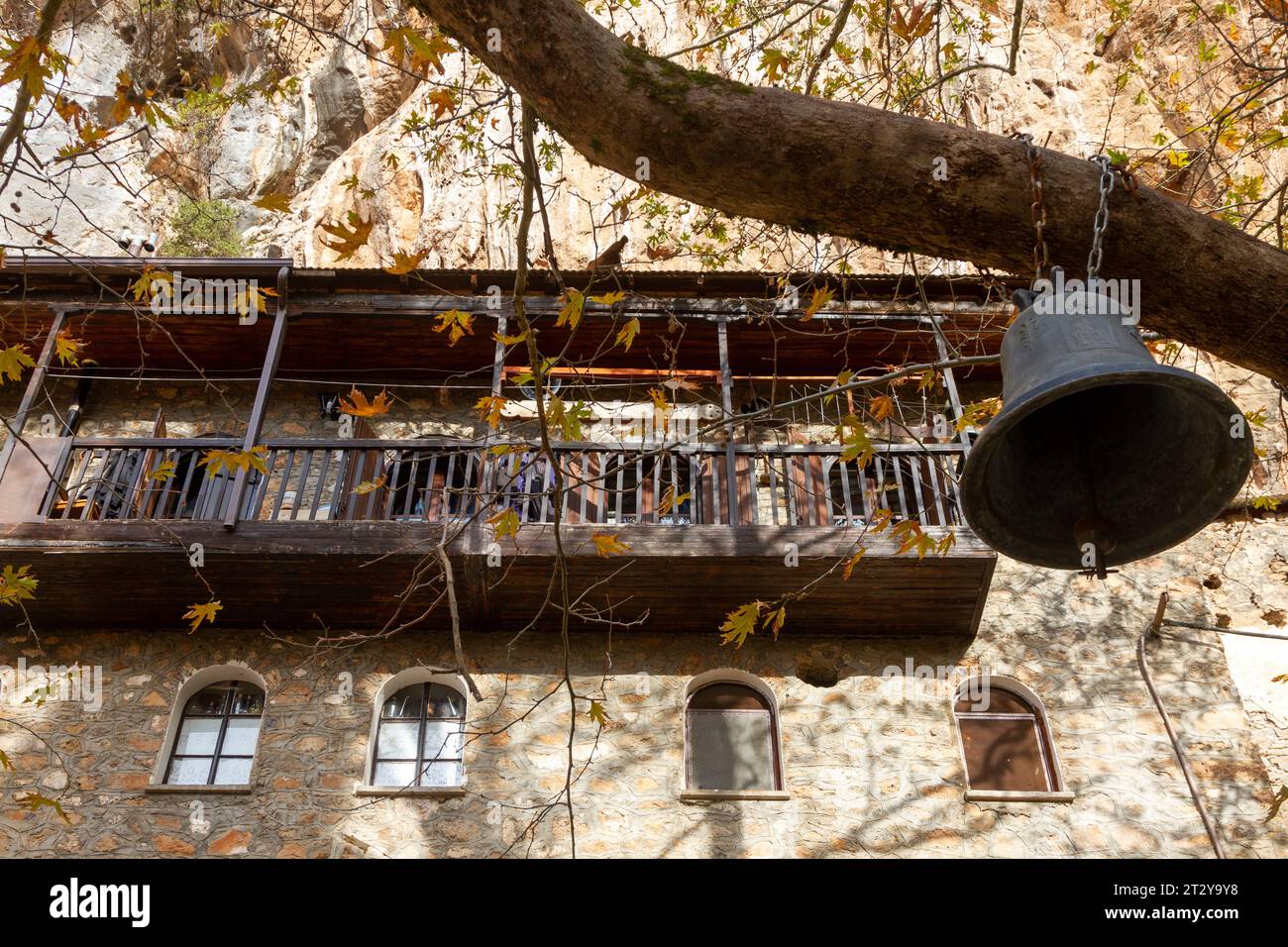An iron bell and part of the monks' cells at the historic Monastery of ...