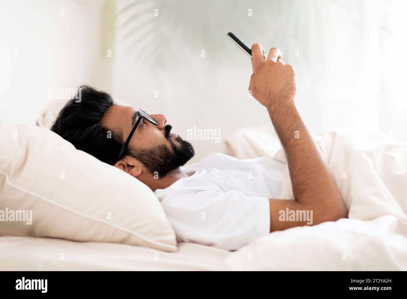 Man lying in bed on side awake hi-res stock photography and images - Alamy