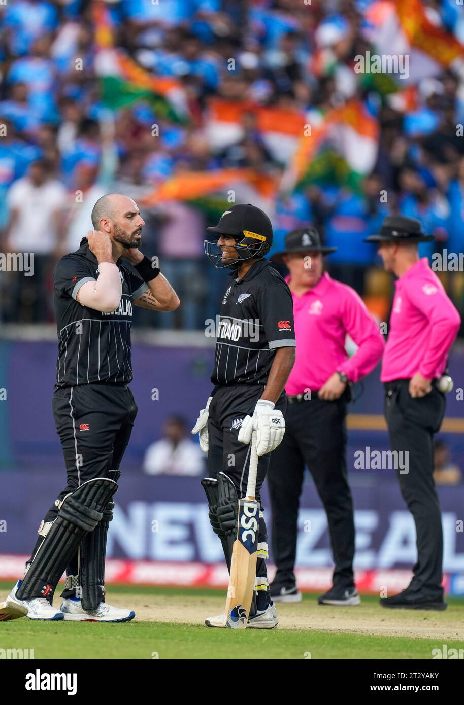 New Zealand's Daryl Mitchell and Rachin Ravindra await a third umpire ...
