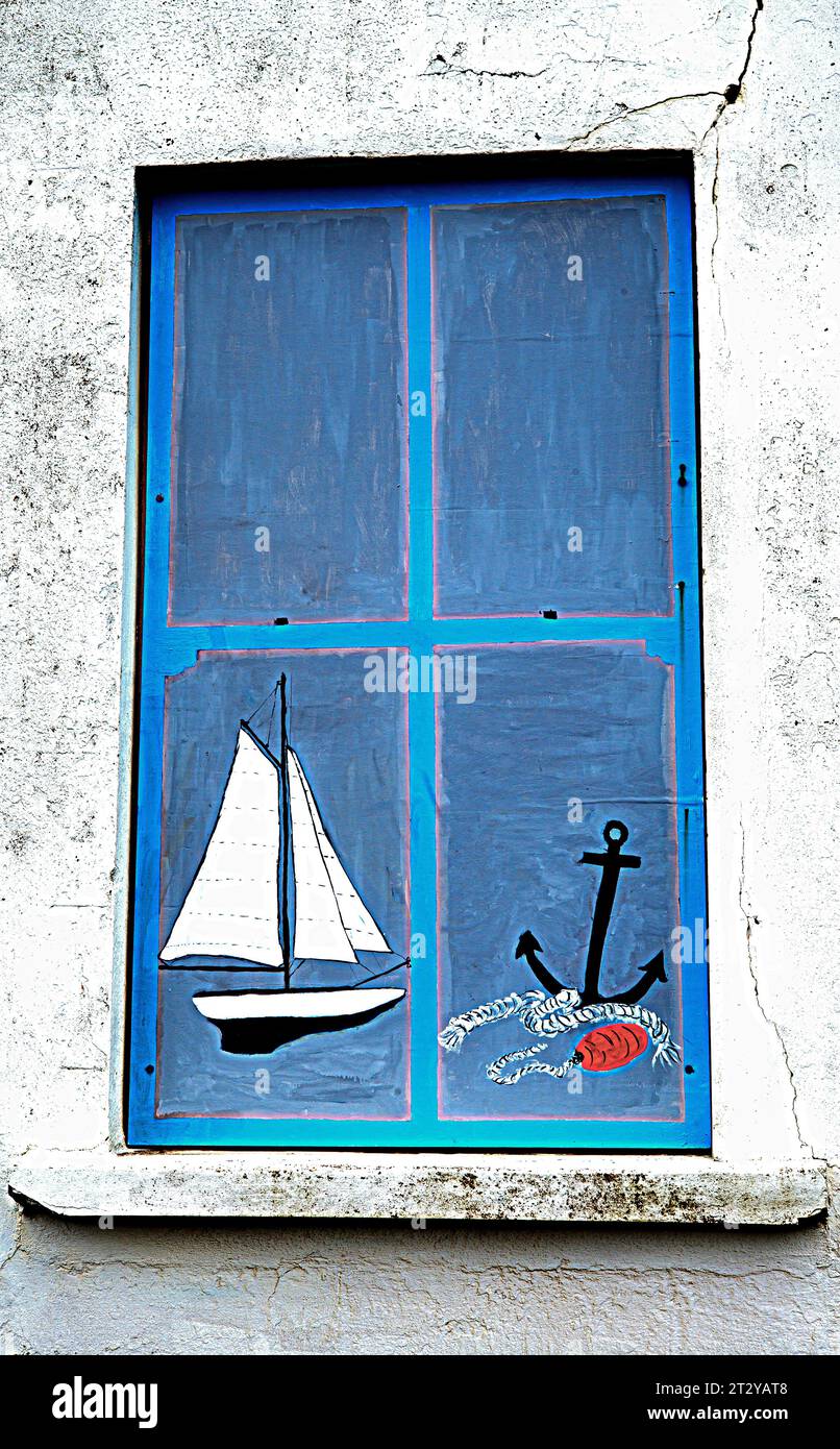 A painted window featuring a nautical scene with a boat and anchor ...