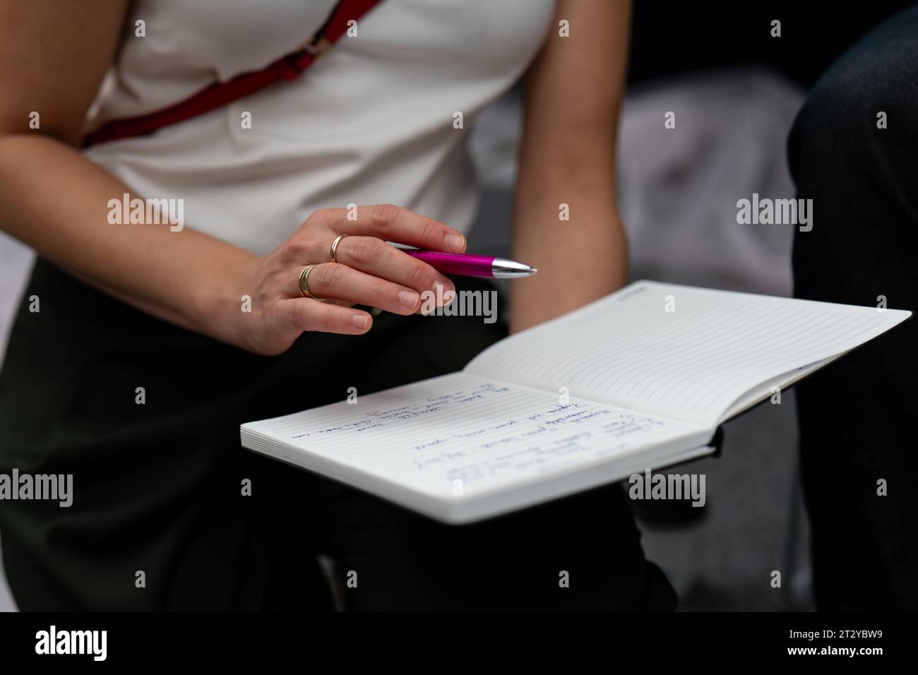 Woman reading notebook hi-res stock photography and images - Alamy