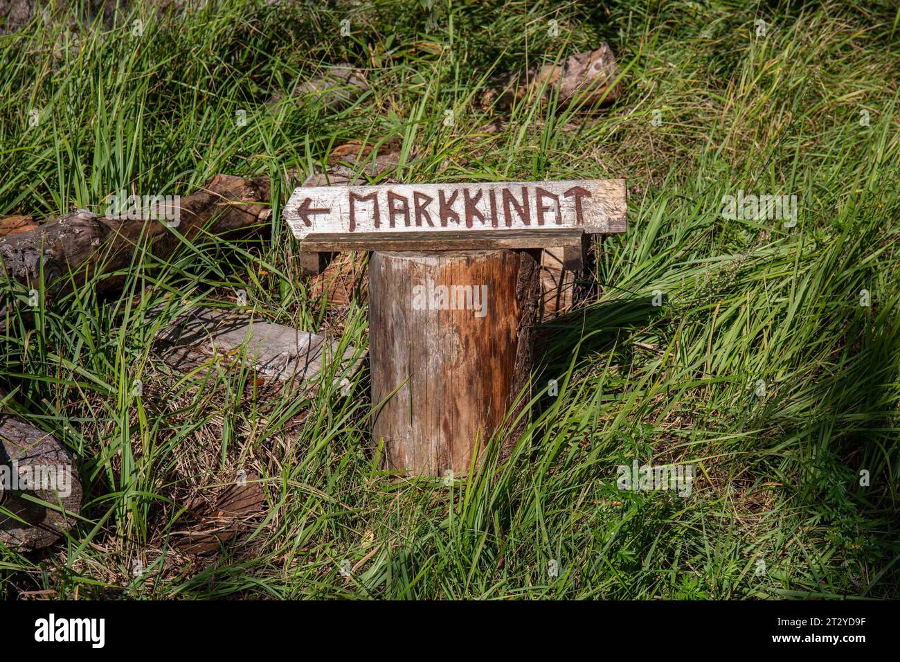 Wooden sign pointing to Iron Age market place reenact in Pukkisaari ...
