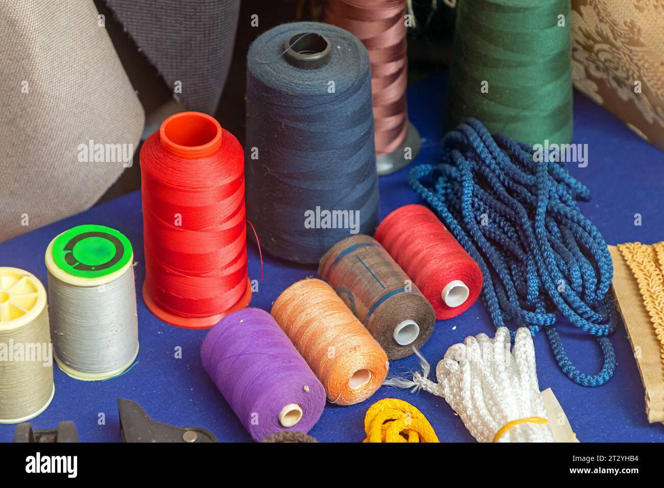 Sewing materials tailoring tools and equipment with colorful threads ...