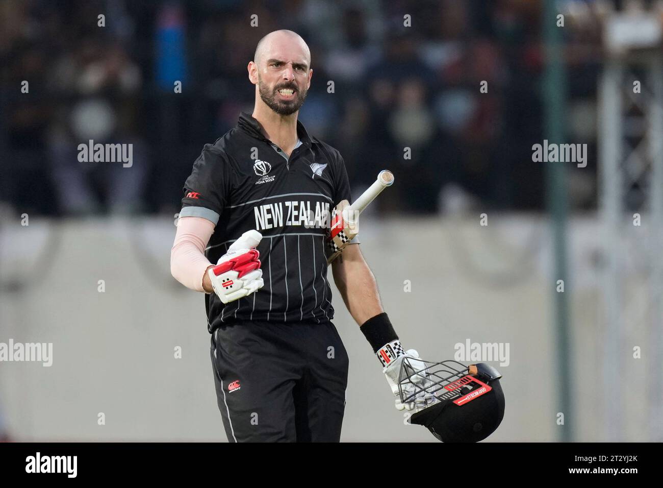 New Zealand's Daryl Mitchell celebrates his century during the ICC Men ...