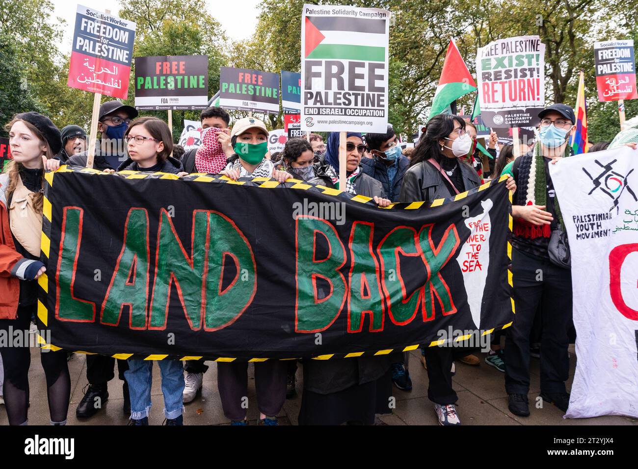 Land Back, from the river to the sea, banner at a Free Palestine ...