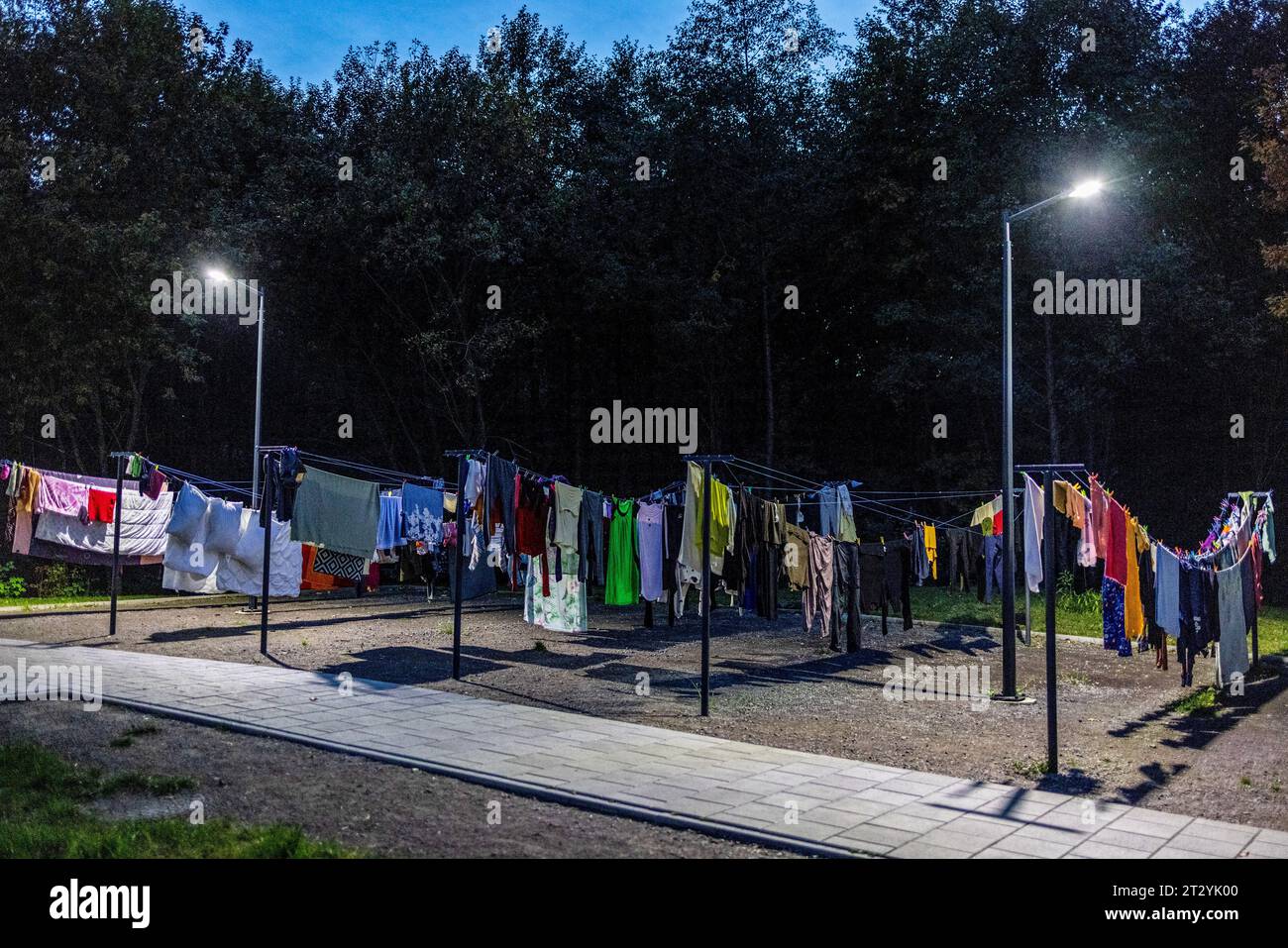 Laundry seen drying at the open space between the modular housing for ...
