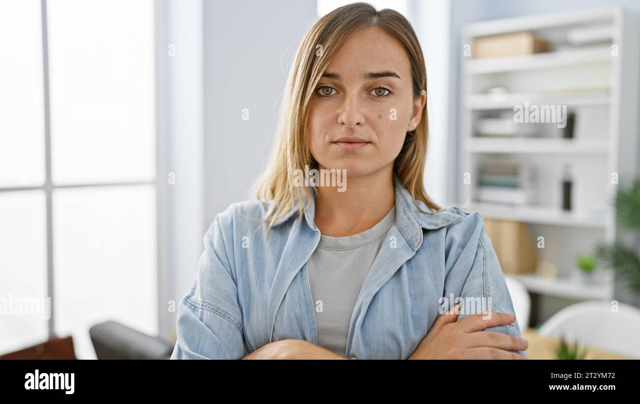 Unwavering young blonde business woman, a picture of serious ...