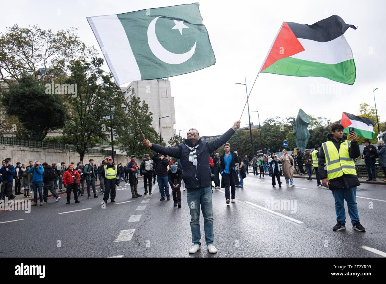London, UK. 21st Oct, 2023. A protestor is seen waving a Palestinian ...