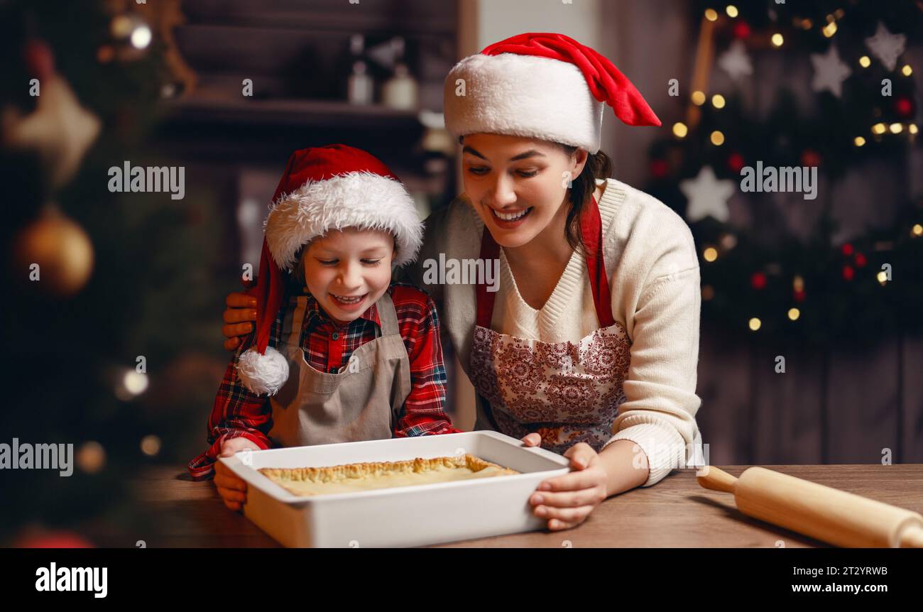 Merry Christmas and Happy Holidays. Family preparation holiday food ...