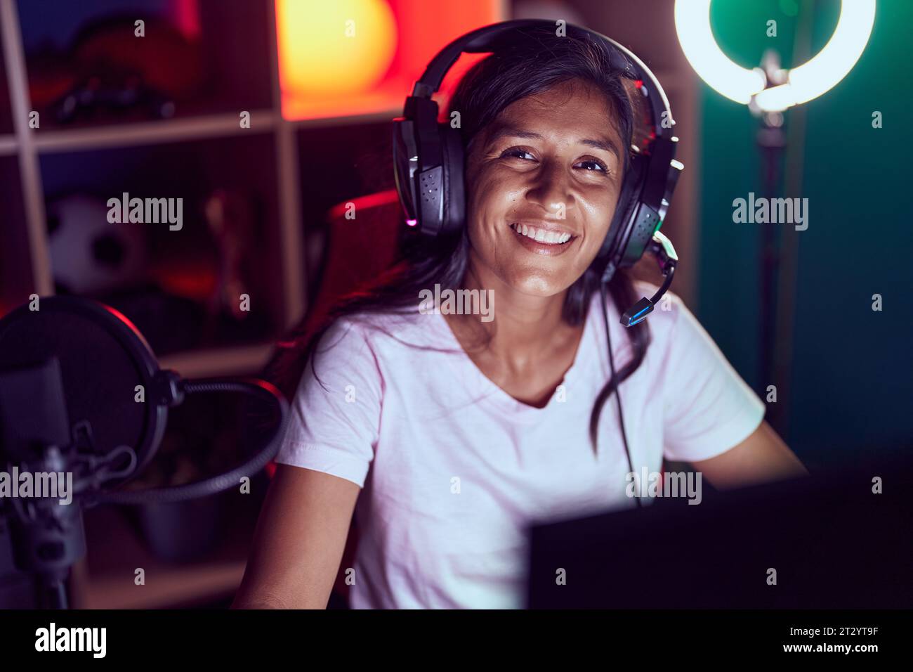 Young beautiful hispanic woman streamer smiling confident sitting on ...