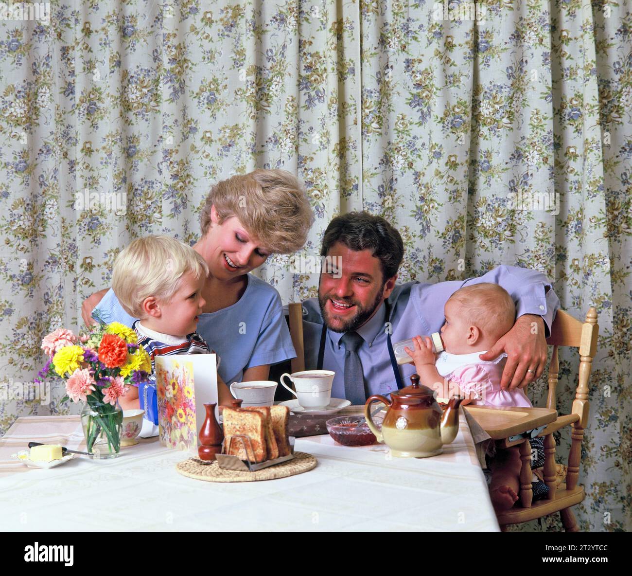 Family indoors having breakfast Stock Photo - Alamy