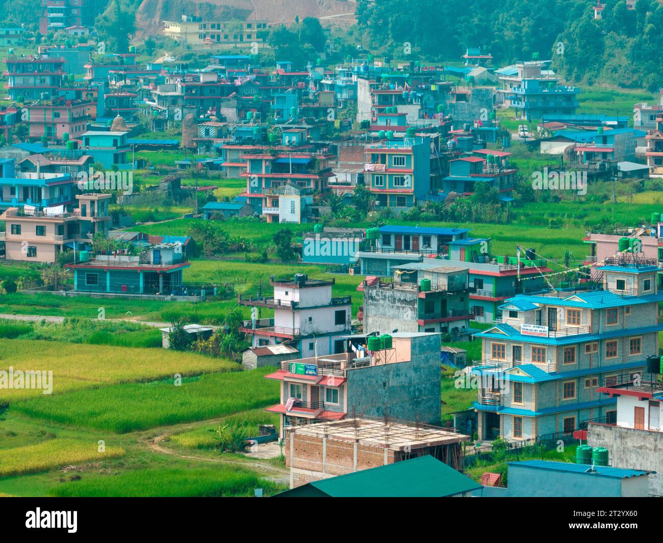 Aerial view of a nepalese rural landscape near Lake Bagnes, rice fields ...