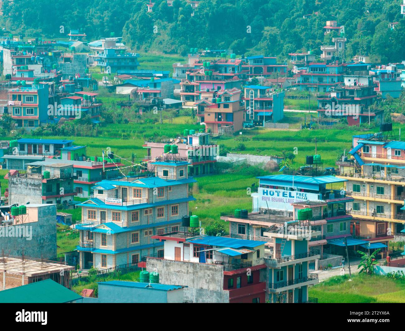 Aerial view of a nepalese rural landscape near Lake Bagnes, rice fields ...