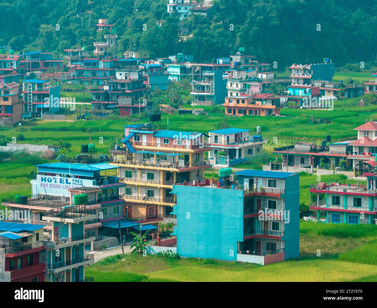 Aerial view of a nepalese rural landscape near Lake Bagnes, rice fields ...