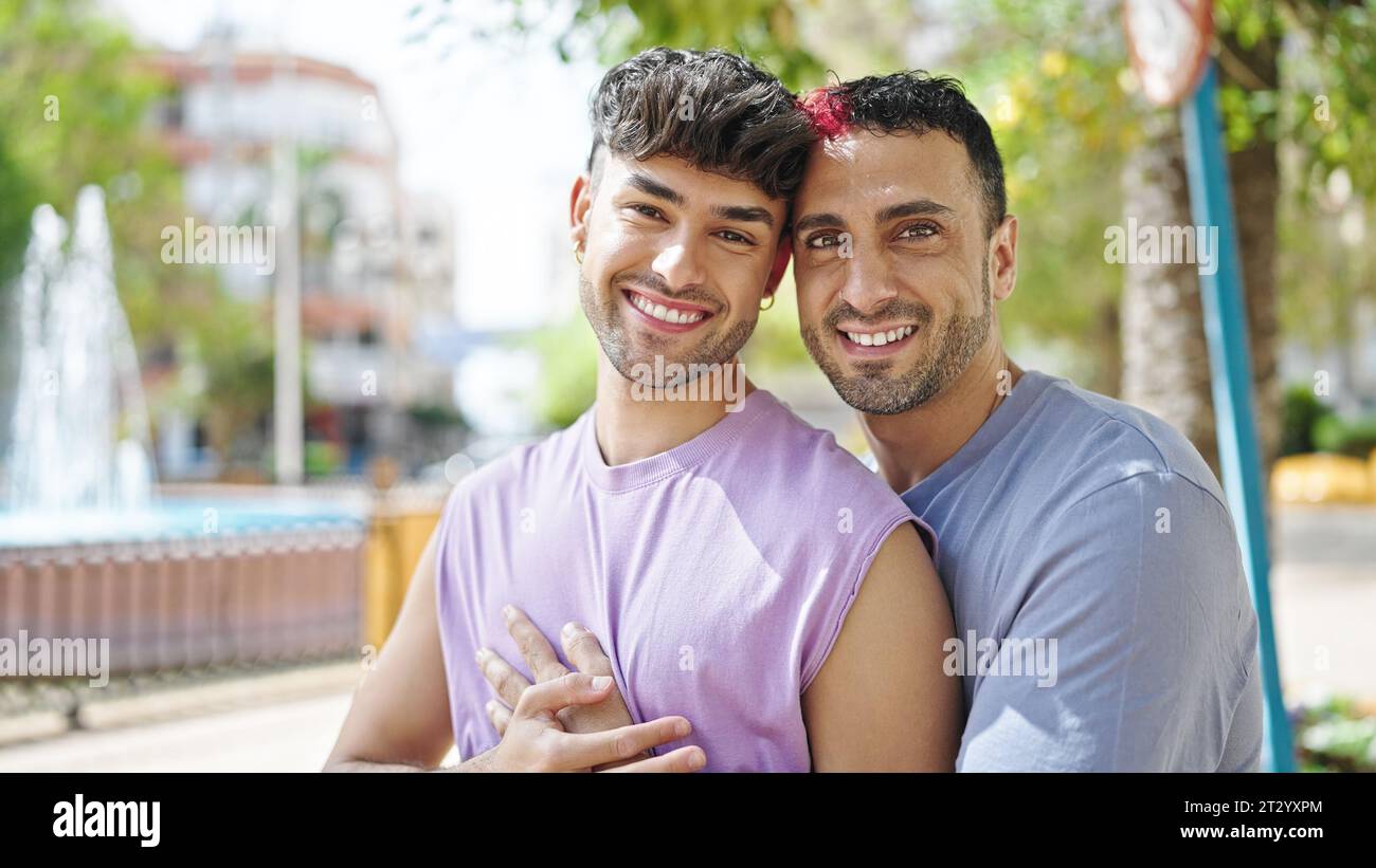 Two men couple smiling confident hugging each other at park Stock Photo ...