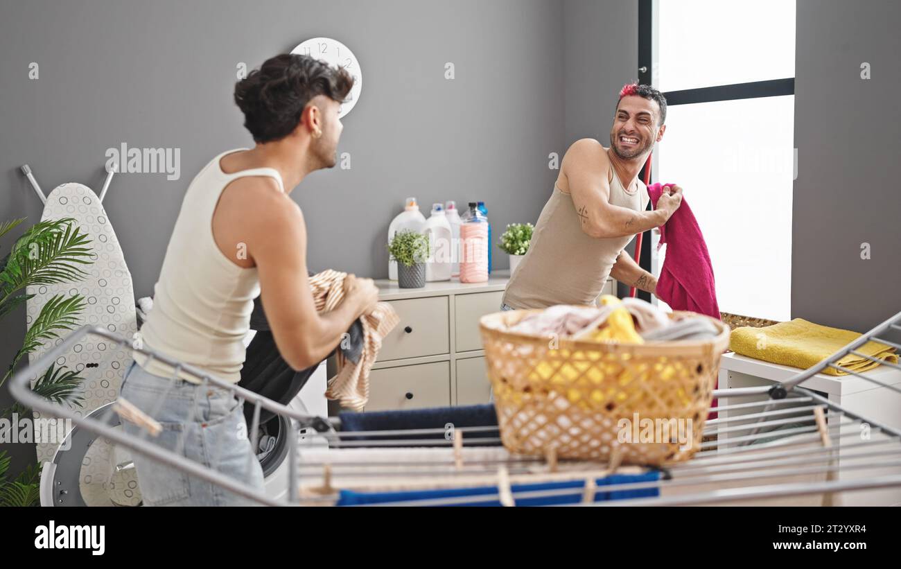 Handsome couple doing housework hi-res stock photography and images - Alamy