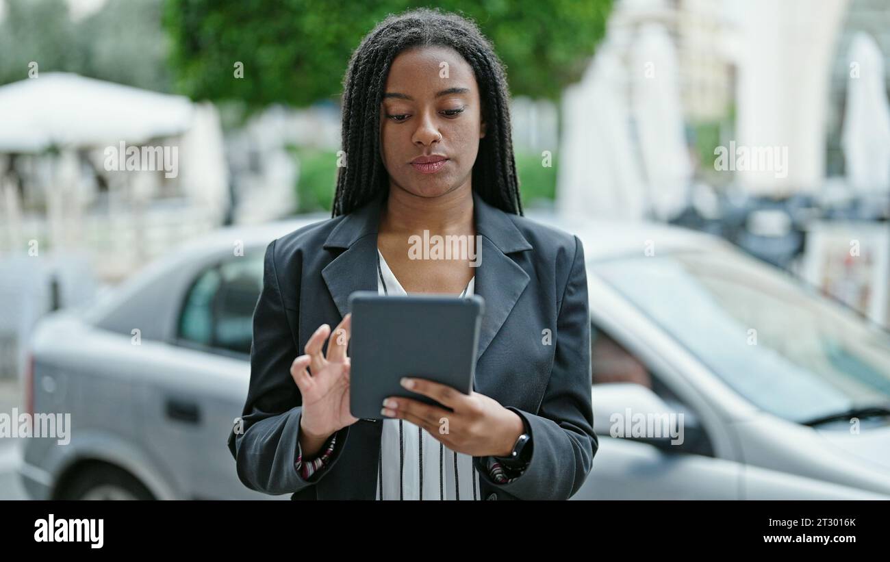 African american woman business worker using touchpad with relaxed ...