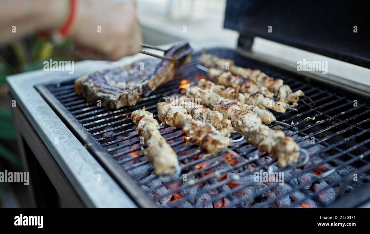 Cooking meat on the barbeque Stock Photo - Alamy