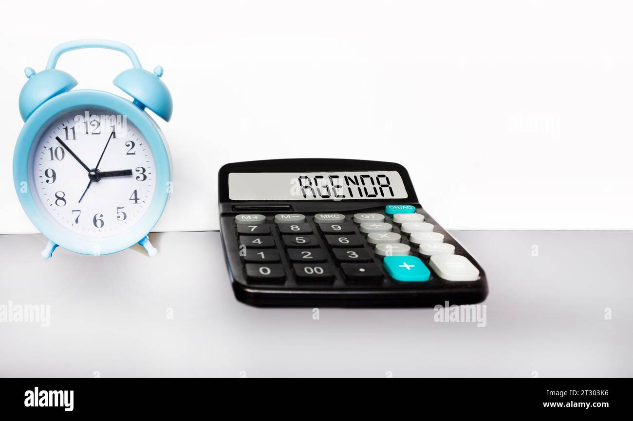 Agenda symbol. Calculator with Agenda word concept on white background ...