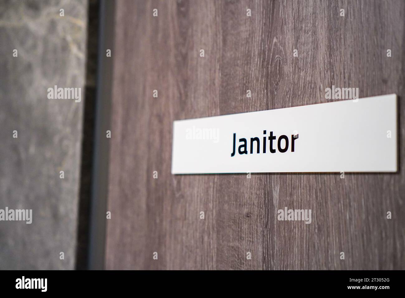 Janitor's sign on a wooden door providing clear guidance and adding a ...