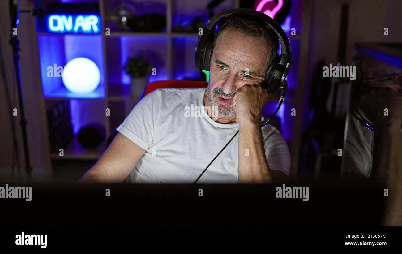 Relaxed tired male gamer playing hi-res stock photography and images ...