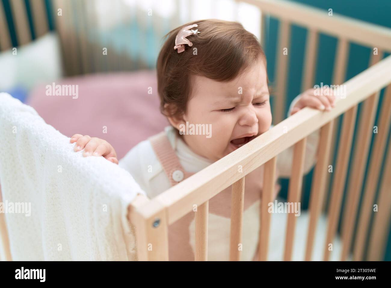 Child standing leaning on bed hi-res stock photography and images - Alamy