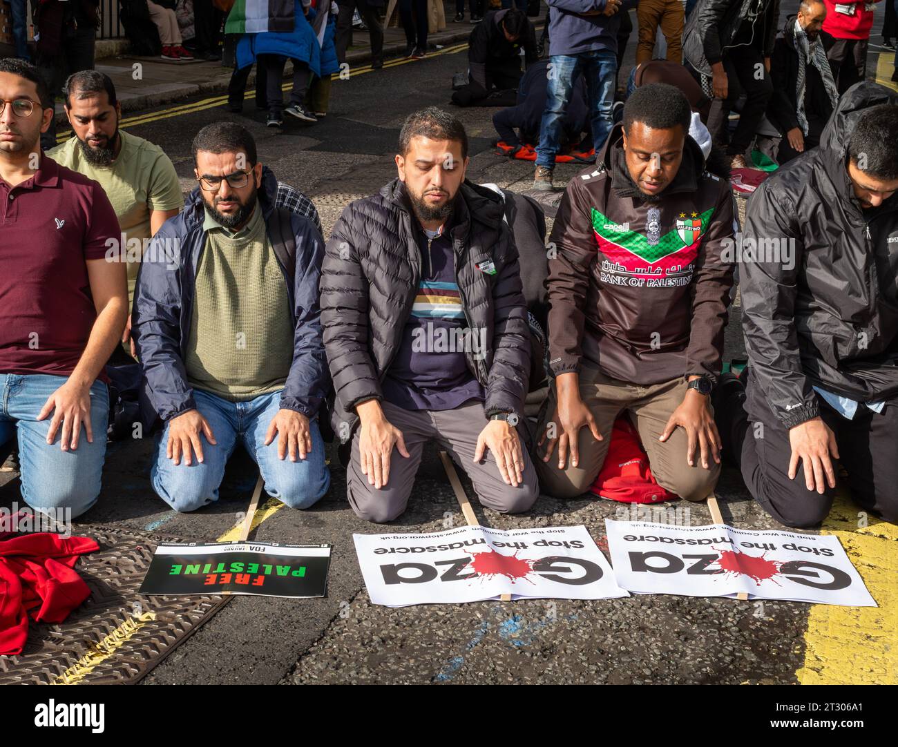 London, UK. 21 Oct 2023: A group of pro-Palestinian men stop for ...