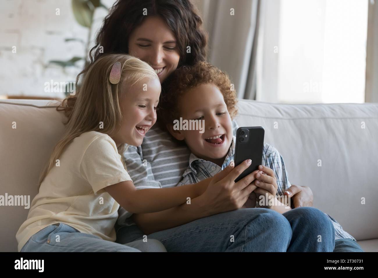 Happy blogger mother and little son and daughter taking selfie Stock ...