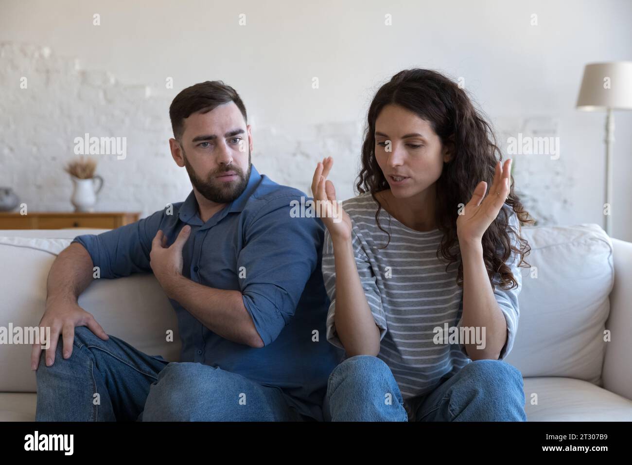 Stressed millennial husband and wife facing conflict Stock Photo - Alamy