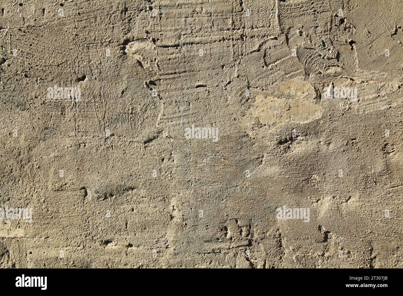 Old, sloppy, multi-layered wall covering of the house. Rough, uneven ...