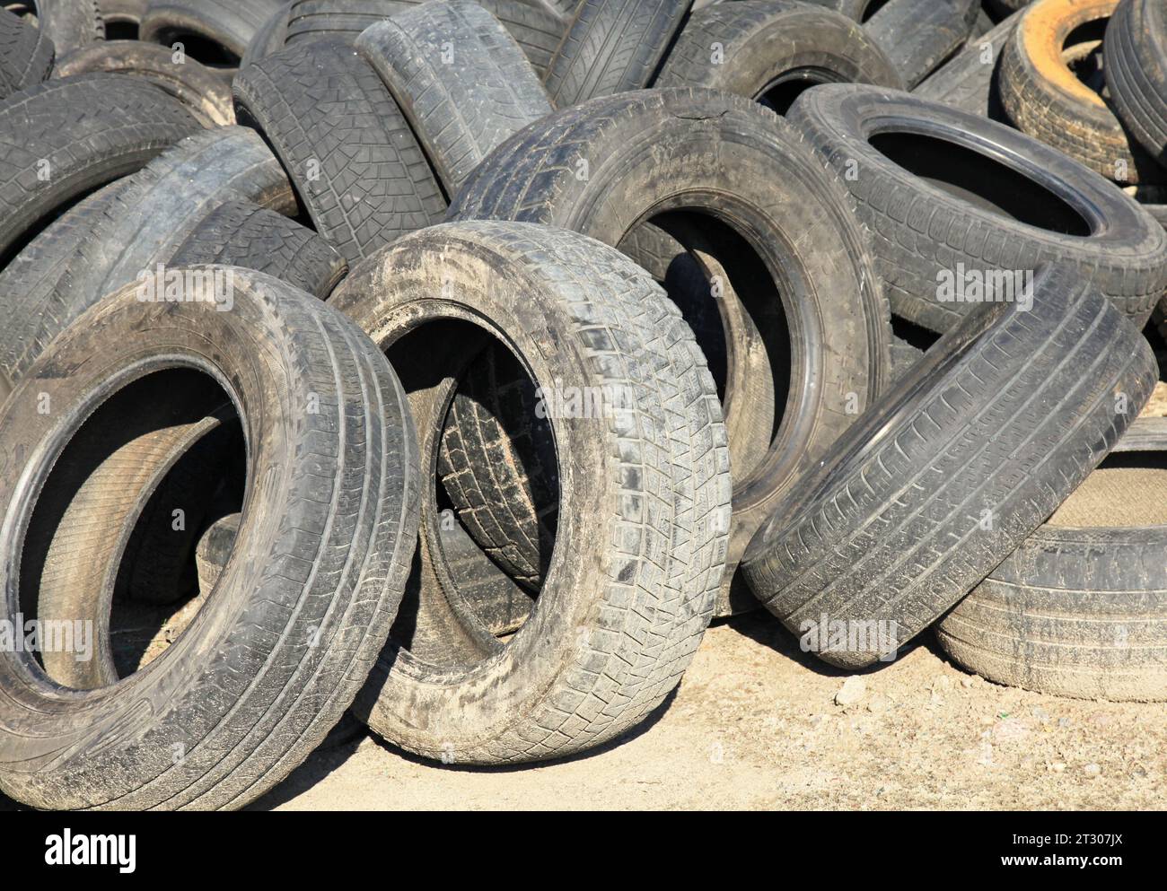 Dirty car tires at a city dump. Industrial pollution of the environment ...