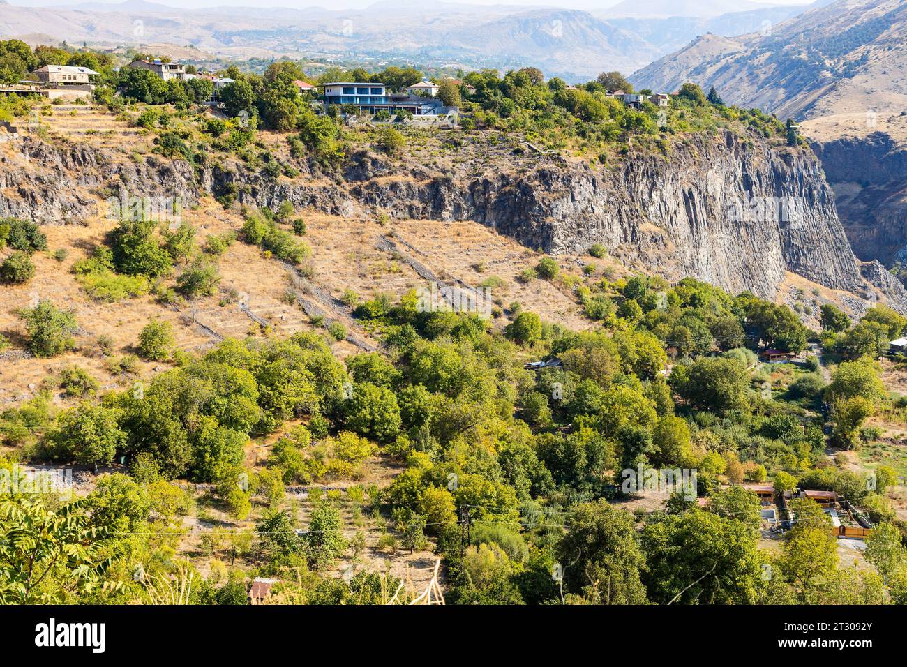 houses of village of Garni on cliff over of Azat River gorge in Gegham ...