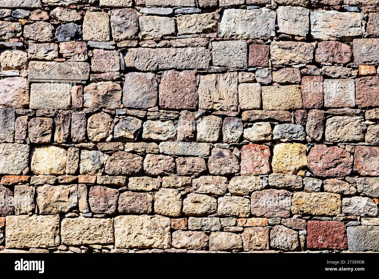 building background - medieval wall from colorful stones Stock Photo ...