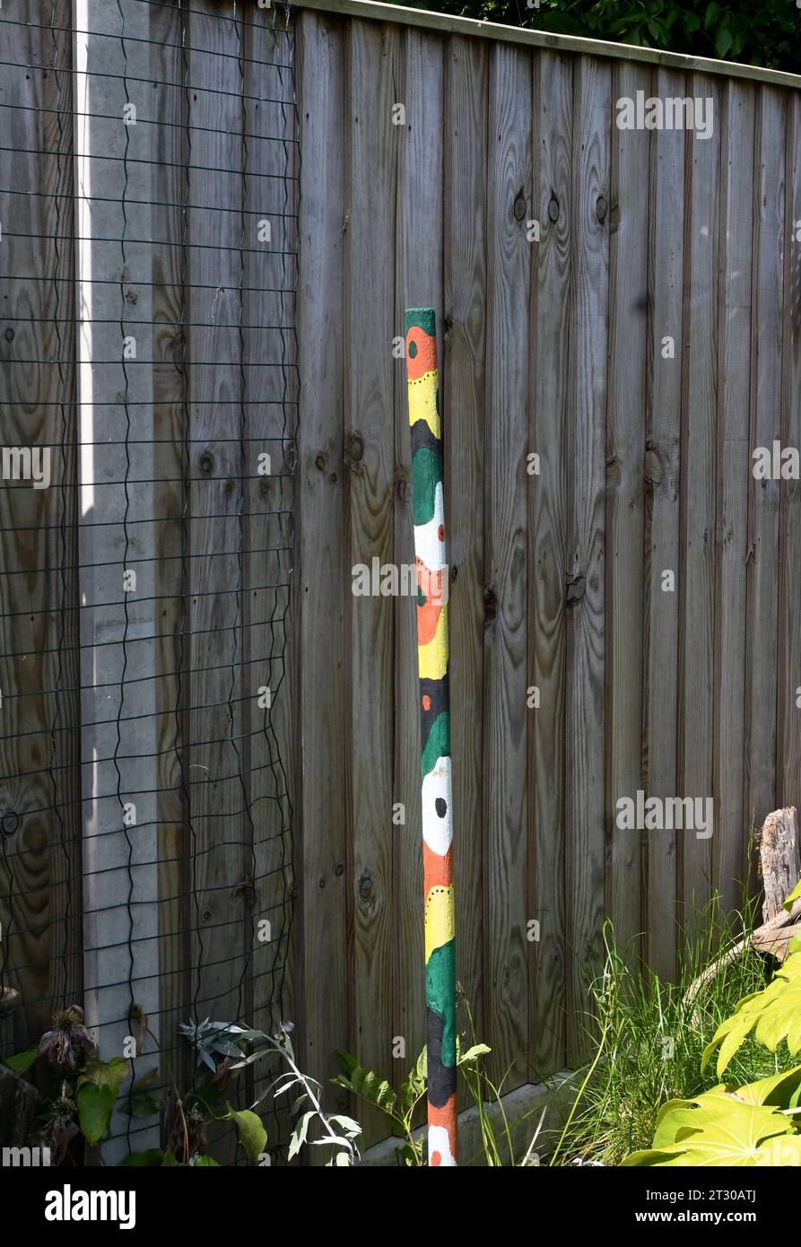 ornamental pole by garden fence Stock Photo - Alamy