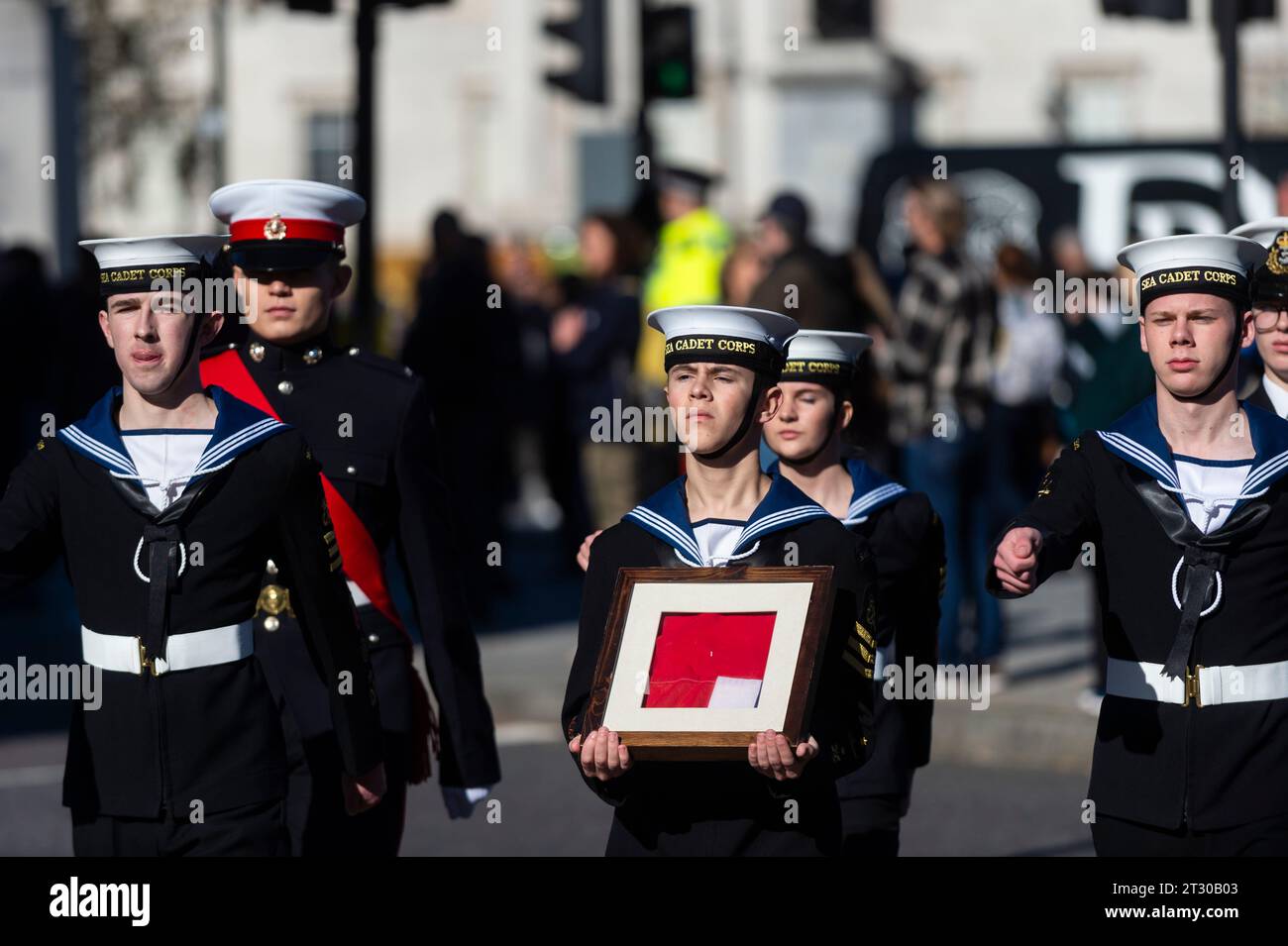 London, UK. 22 October 2023. A sea cadet carrying a historic naval flag ...