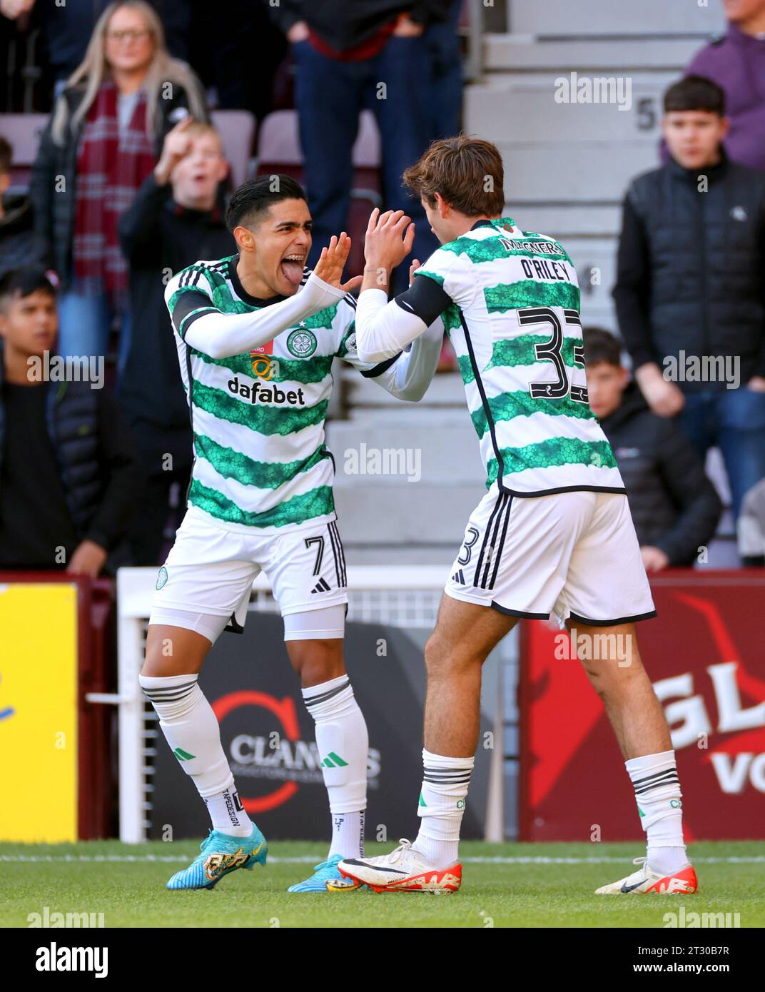 Celtic's Matt O'Riley (right) celebrates with team-mate Luis Palma ...