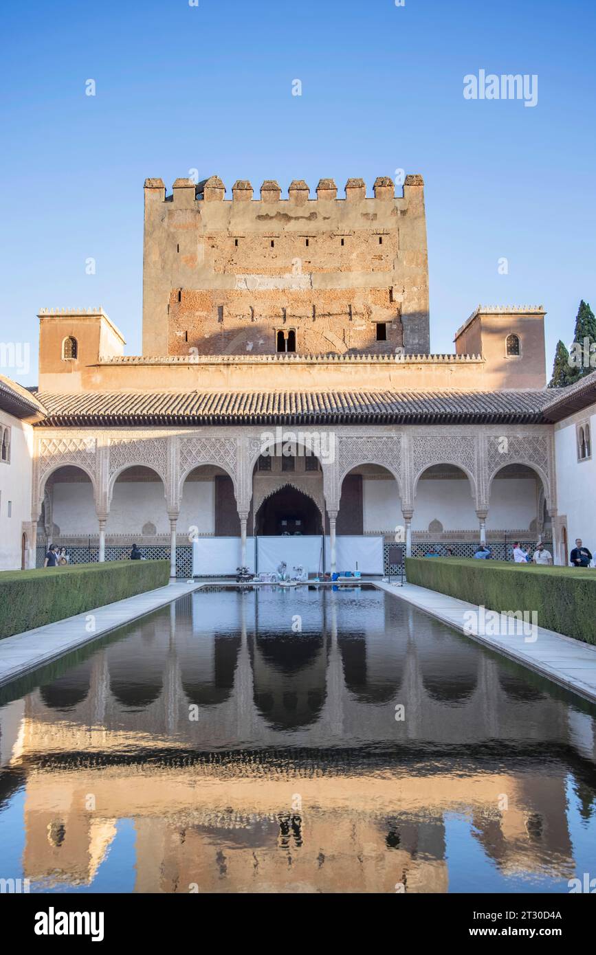 reflections of the fortress and palace of the alhambra in granada ...