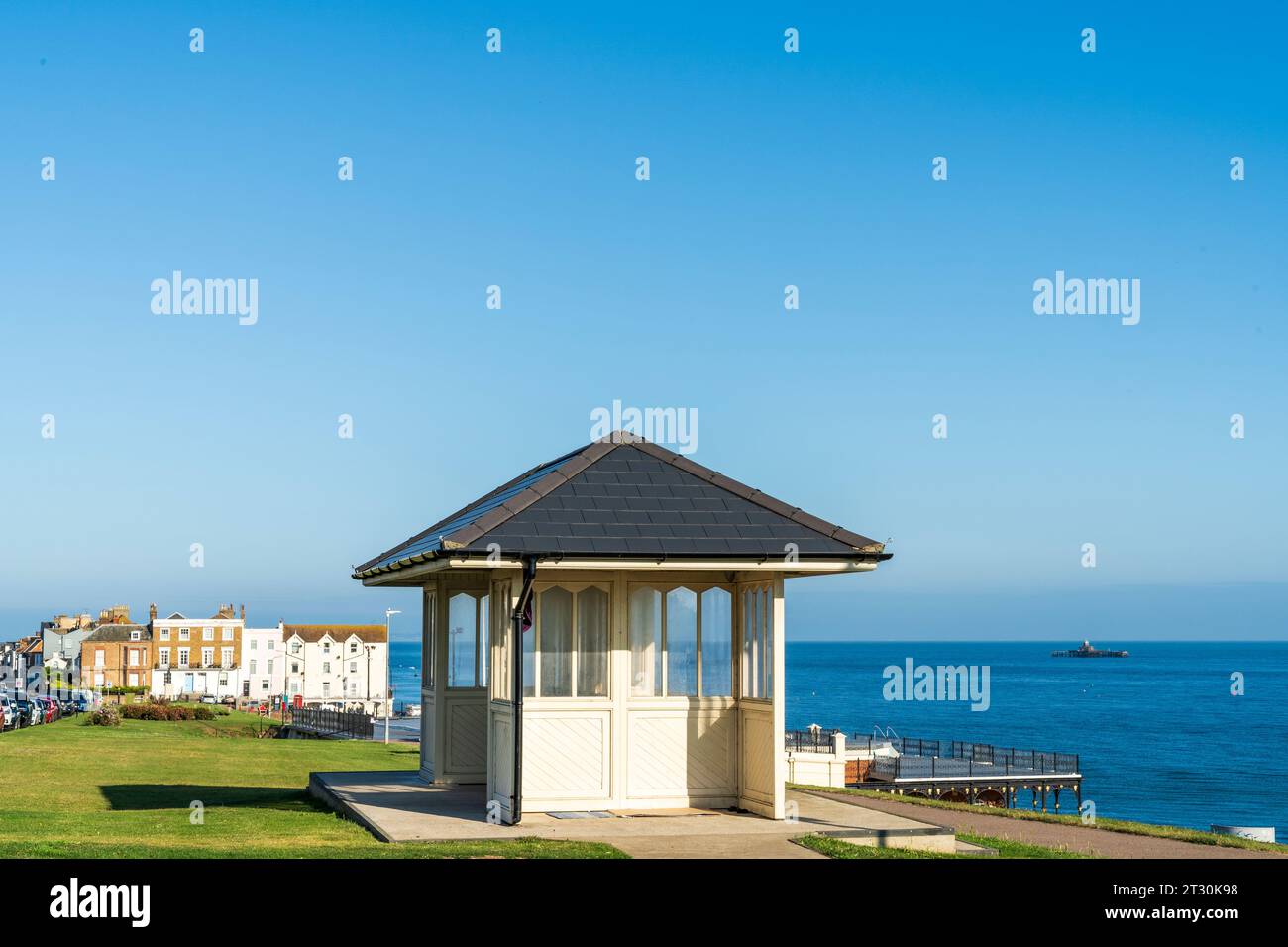 Victorian seafront shelter on the green overlooking the sea and the ...