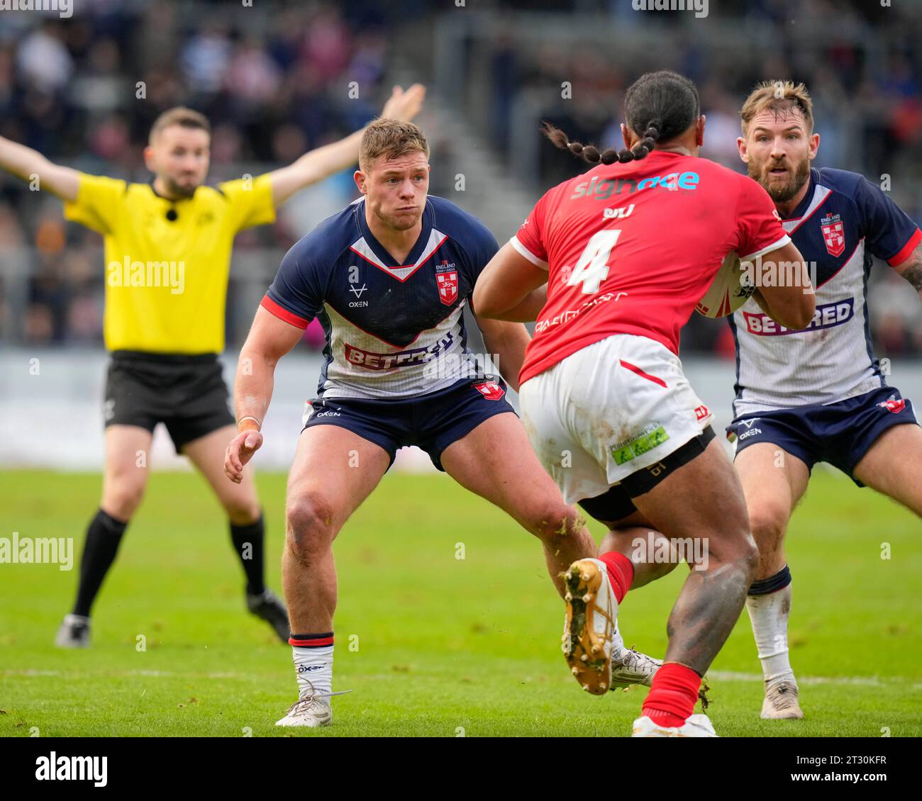 Moses Suli # of Tonga runs at Tom Burgess #8 of England and Daryl Clark ...