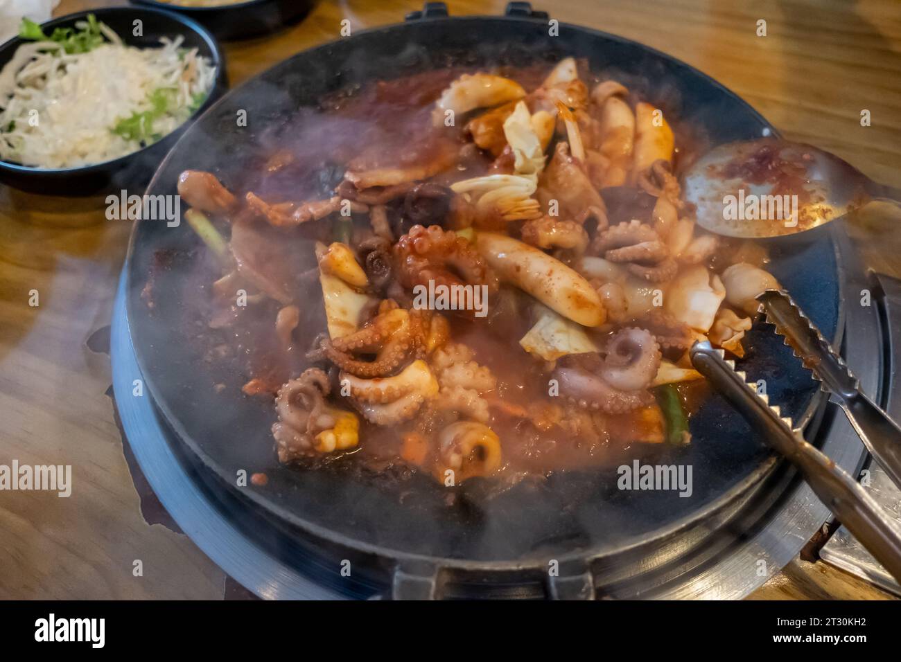 Spicy stir-fried Octopus Pork Belly on pan, Korean food Stock Photo - Alamy