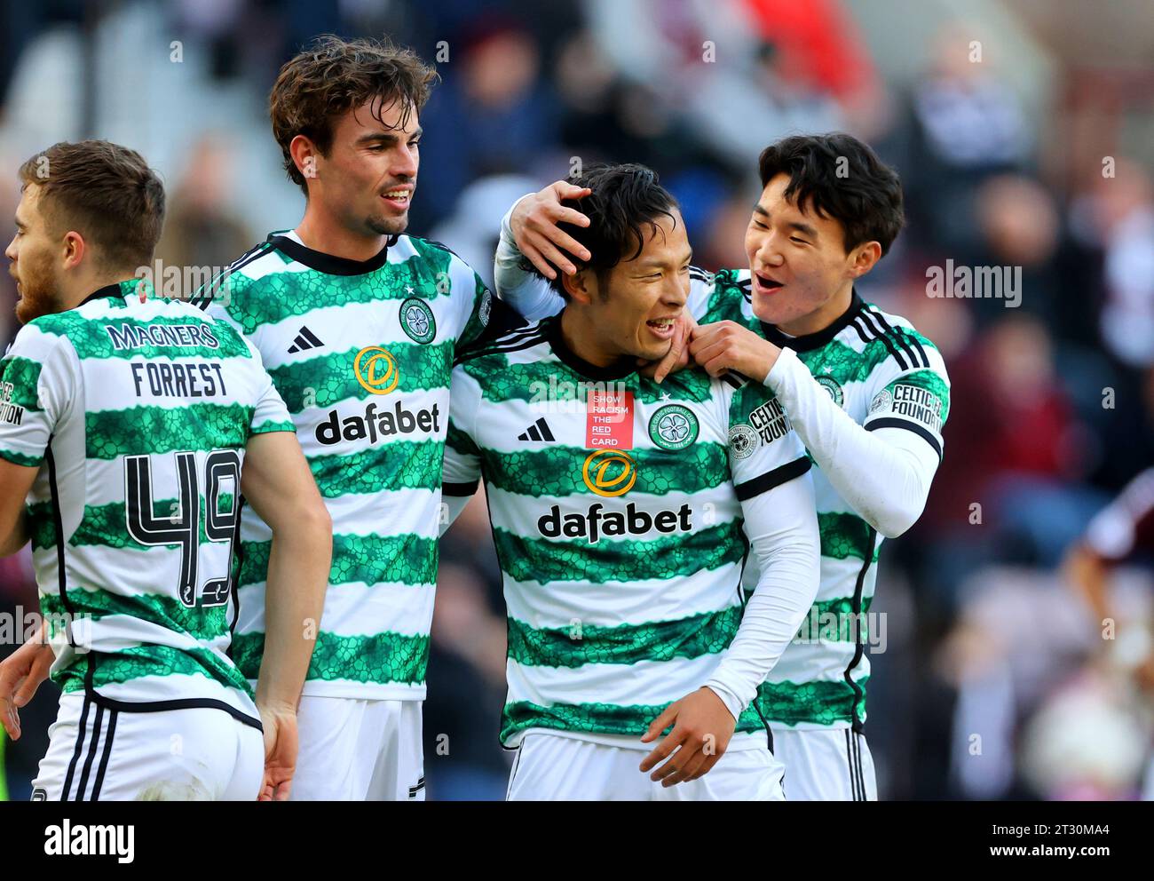 Celtic's Tomoki Iwata (centre right) celebrates scoring their side's ...