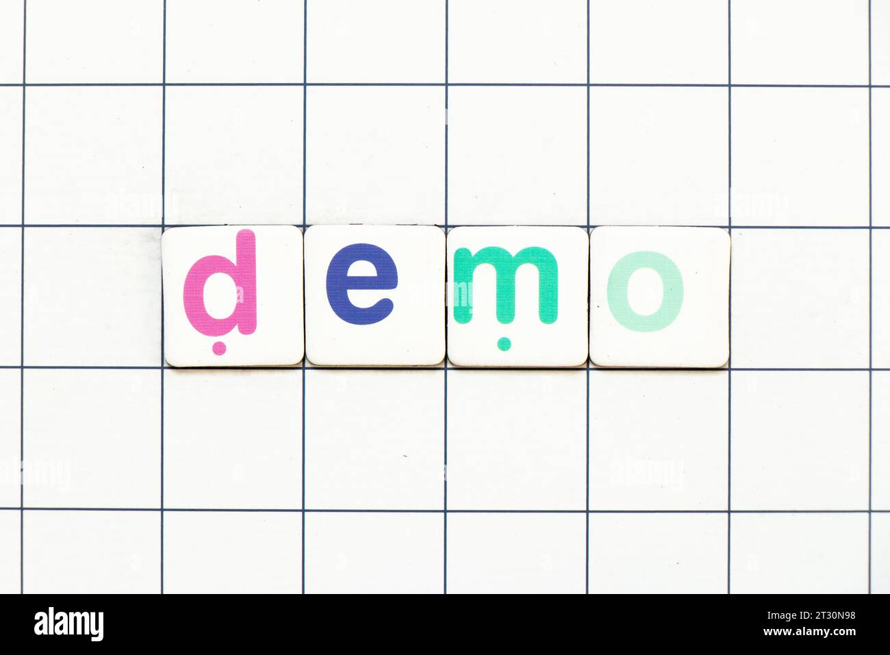 Colorful tile letter in word demo on white grid background Stock Photo ...