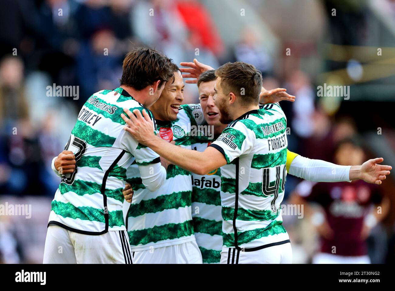Celtic's Tomoki Iwata (second left) celebrates with his team-mates ...