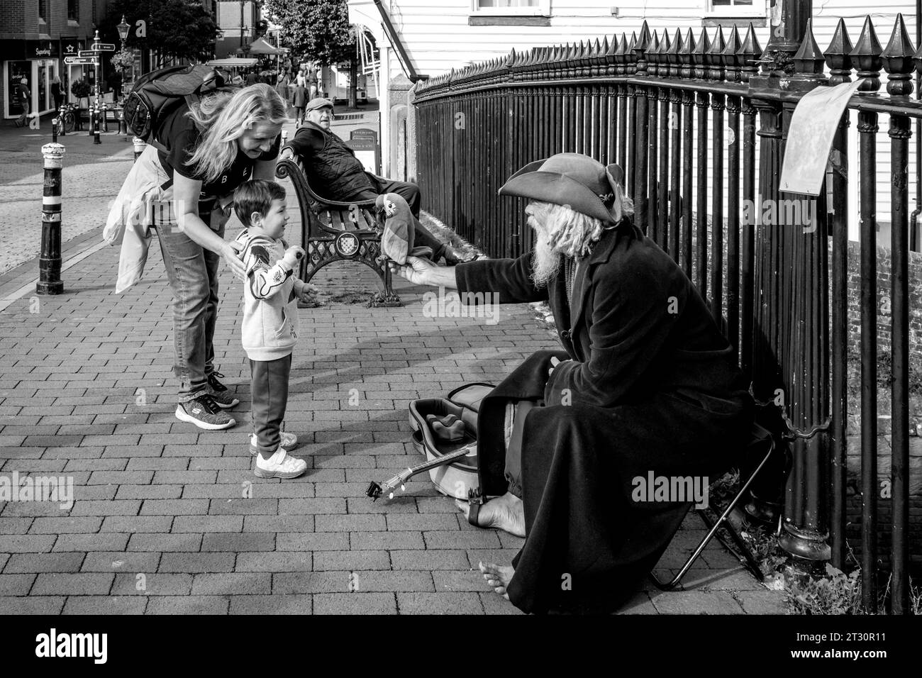 A Child Watches A Pirate Street Entertainer With His Toy Parrot, High ...