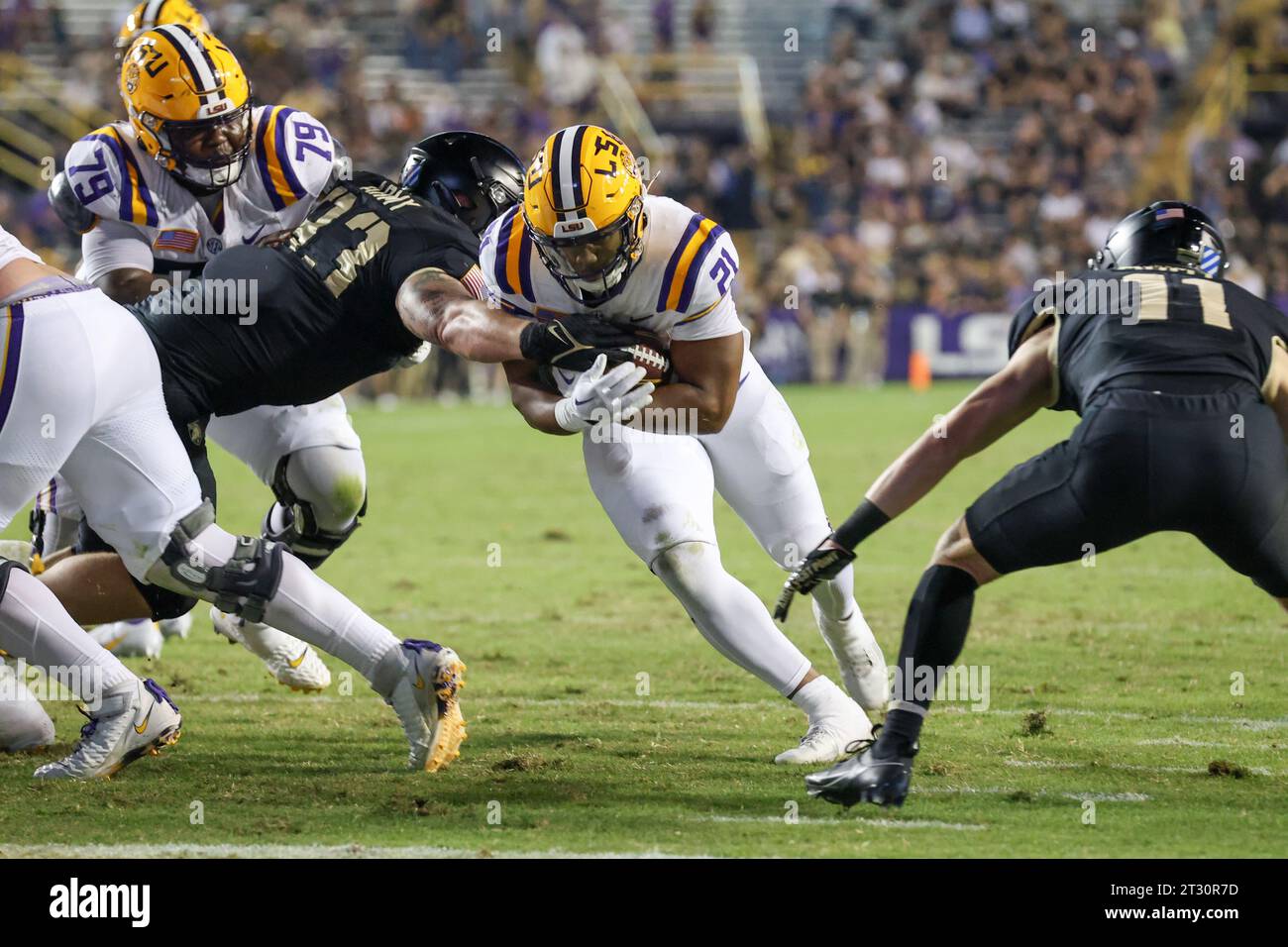 Baton Rouge, LA, USA. 21st Oct, 2023. LSU running back Noah Cain (21) tries to break a tackle ...