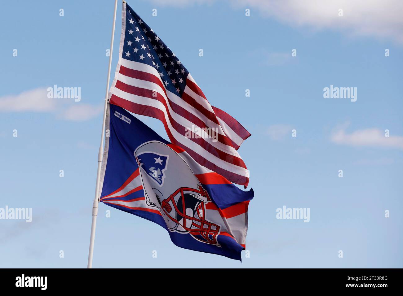 New England Patriots and American flags fly while fans tailgate prior ...