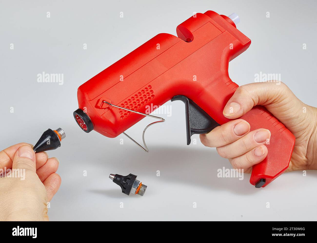 working with red hot glue gun Stock Photo - Alamy