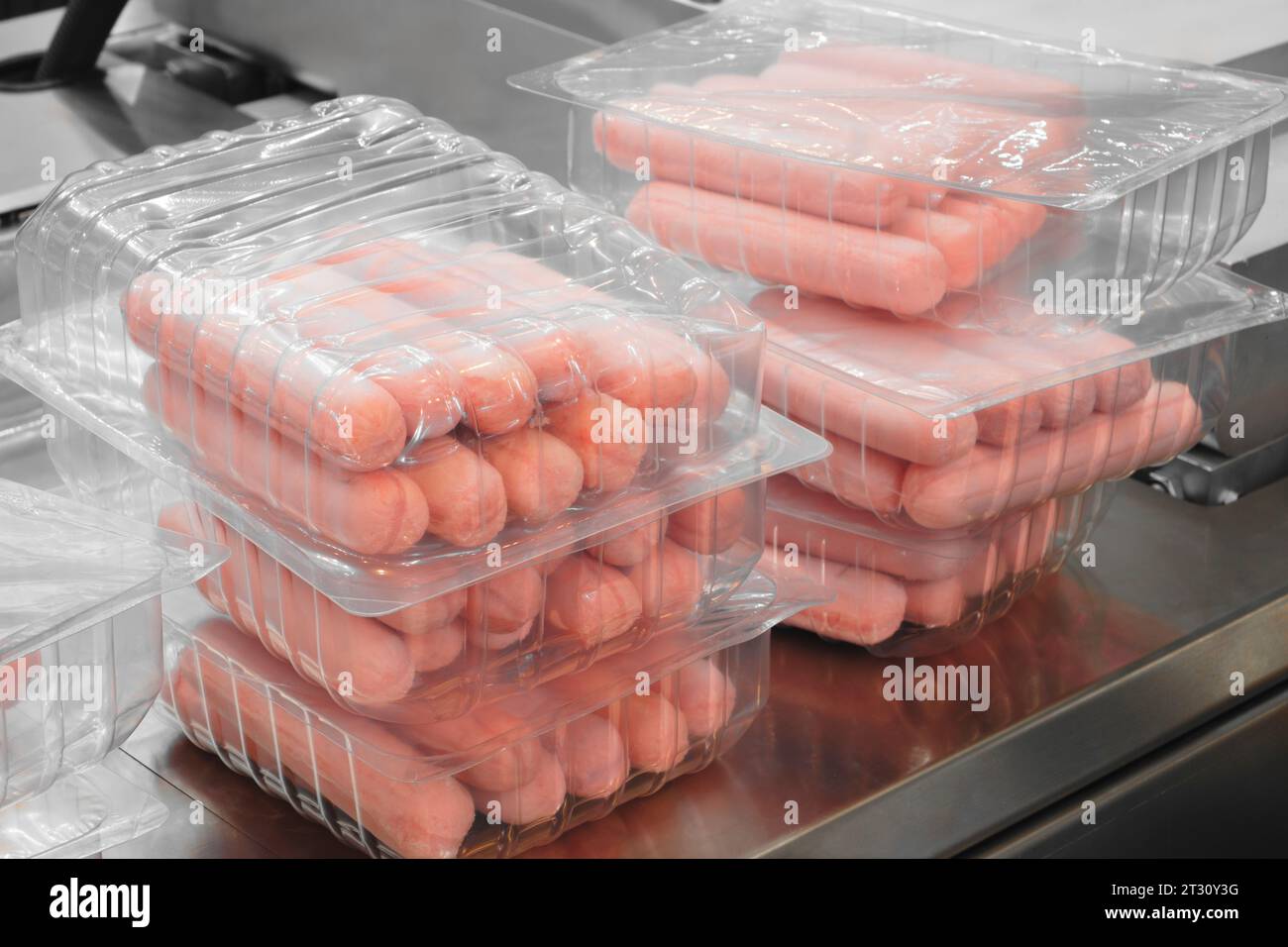 Sausages. Packing line of sausage. Industrial manufacture of sausage ...