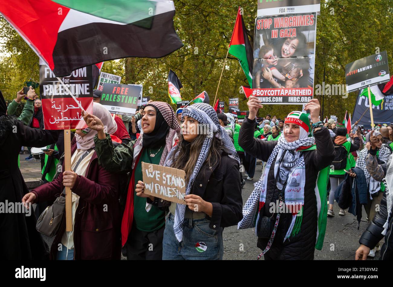 London / UK - Oct 21 2023: Muslim women hold placards and flags as they ...