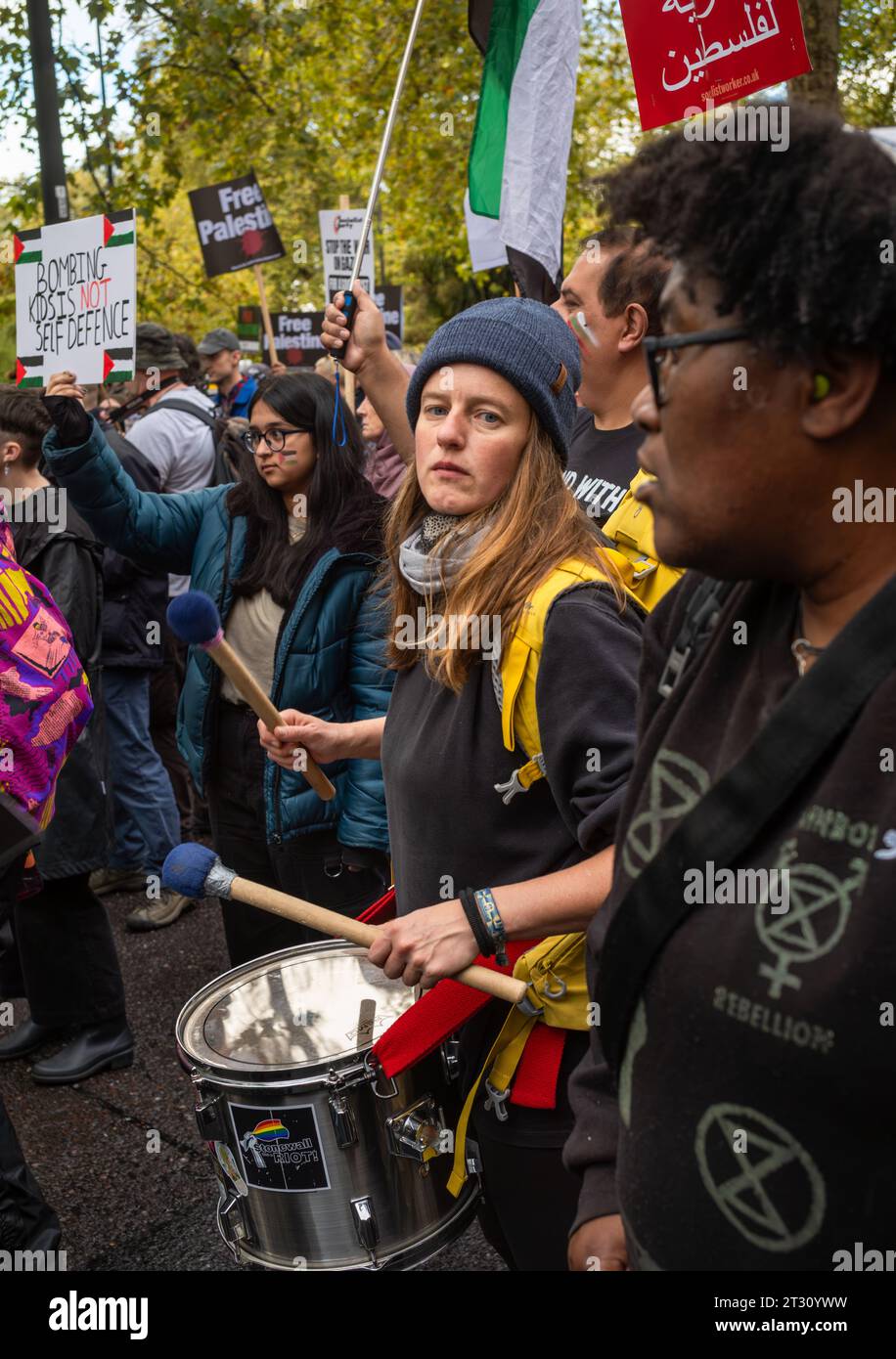 London / UK - Oct 21 2023: A female pro-Palestinian protester plays a ...